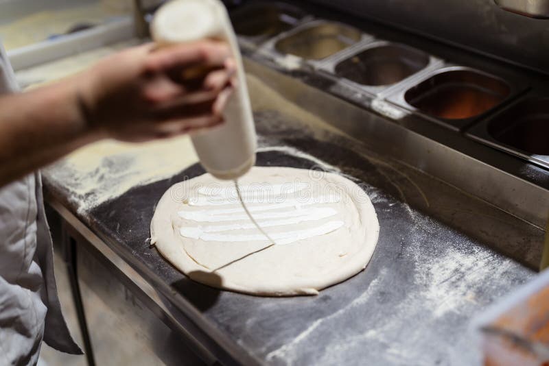 Male Chef Hands Making Pizza in the Pizzeria Kitchen Stock Image ...