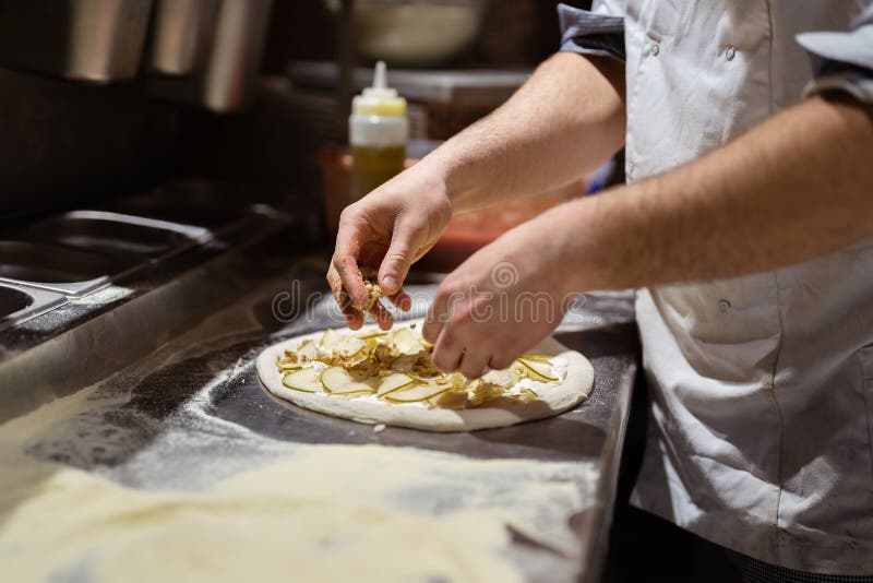 Male Chef Hands Making Pizza in the Pizzeria Kitchen Stock Photo ...
