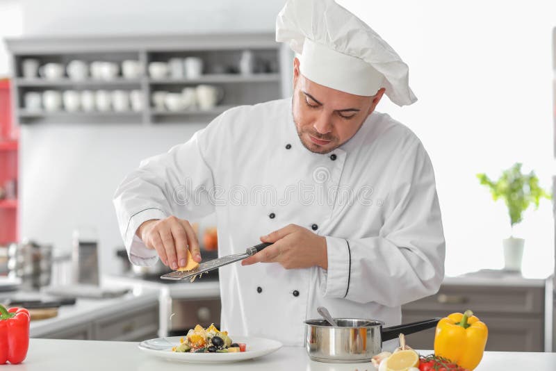 Male Chef Making Tasty Salad in Kitchen Stock Photo - Image of ...