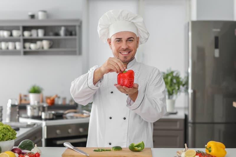 Male Chef with Pepper in Kitchen Stock Image - Image of meal ...