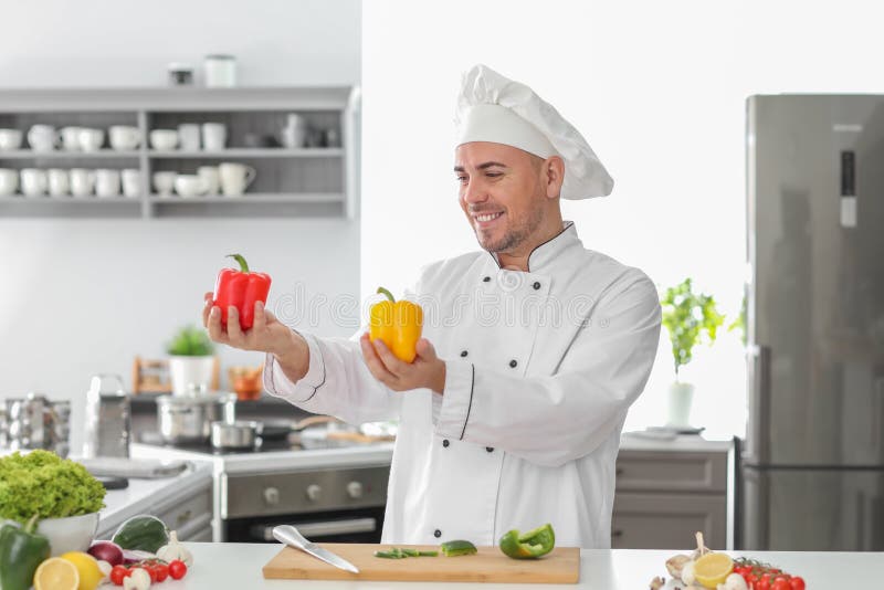 Male Chef with Peppers in Kitchen Stock Photo - Image of caucasian ...