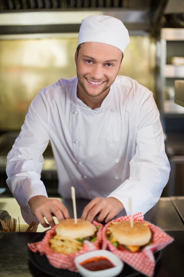 Male Chef Preparing Burger in Commercial Kitchen Stock Photo - Image of ...