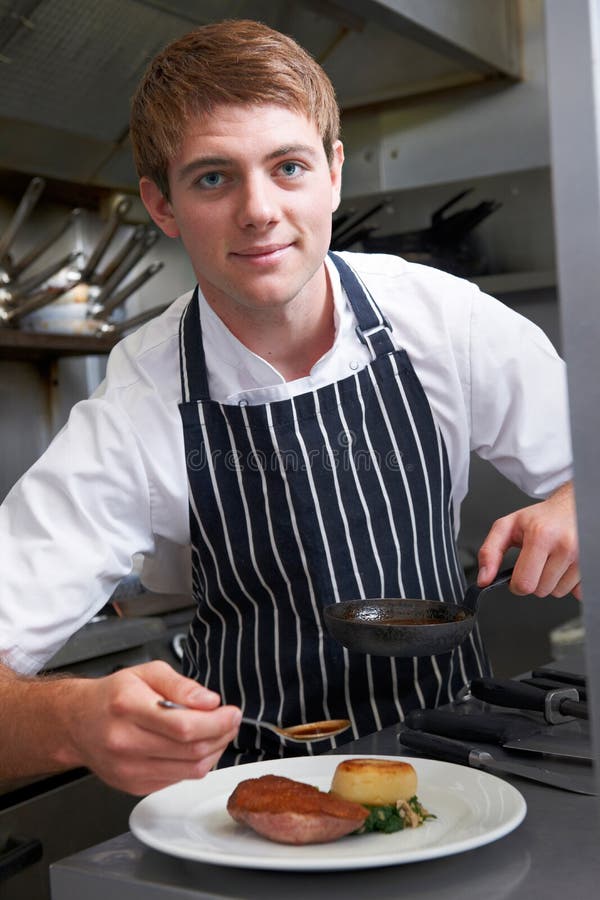 Male Chef Preparing Meal in Restaurant Kitchen Stock Image - Image of ...