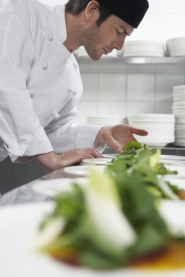 Male Chef Preparing Salad in Kitchen Stock Image - Image of precision ...