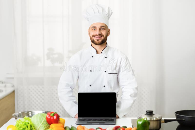 Male Chef Showing Laptop Computer Screen Standing in Kitchen, Mockup ...