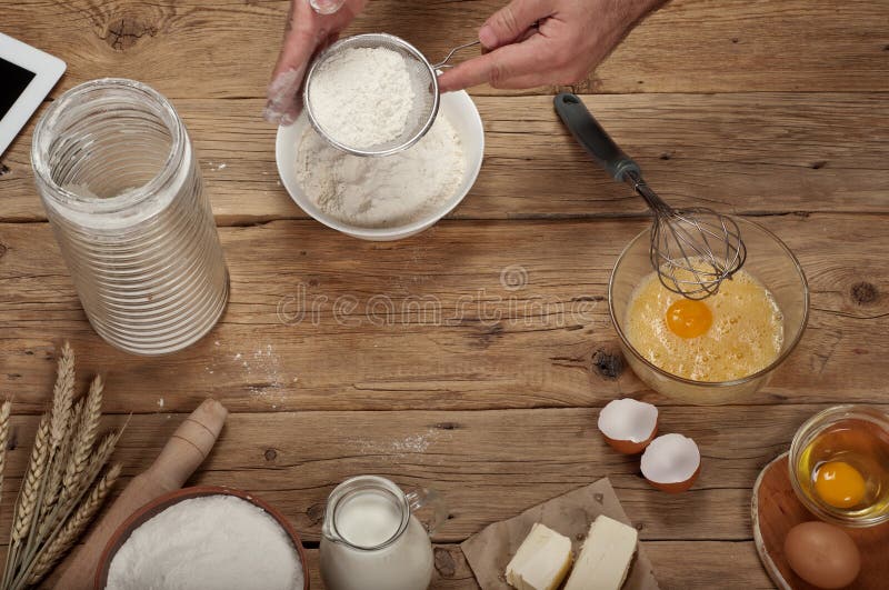 Male chef sifting flour stock image. Image of cooking - 64836153