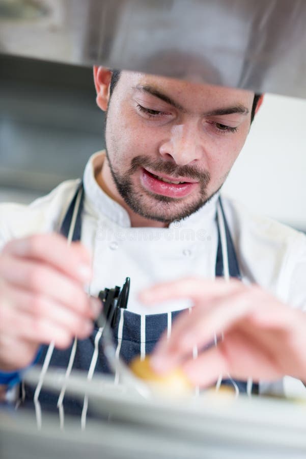 Male Chef at work stock photo. Image of preparing, kitchen - 76153418