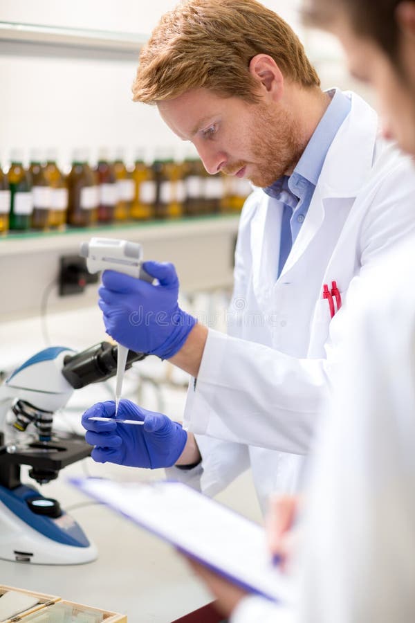 Male Scientist Using Chemistry Liquid for Research Stock Image - Image ...