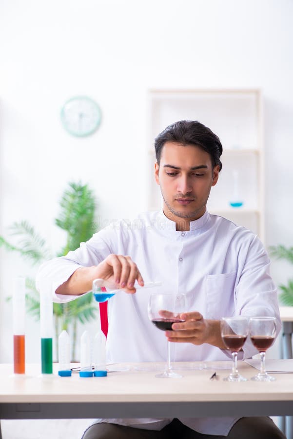 Male Chemist Examining Wine Samples at Lab Stock Photo - Image of ...