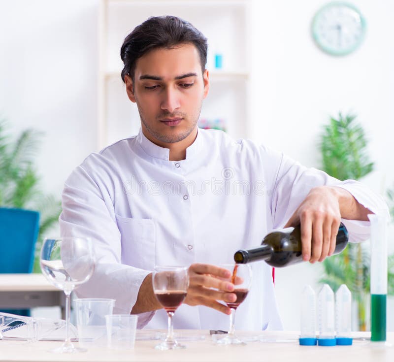 Male Chemist Examining Wine Samples at Lab Stock Photo - Image of ...