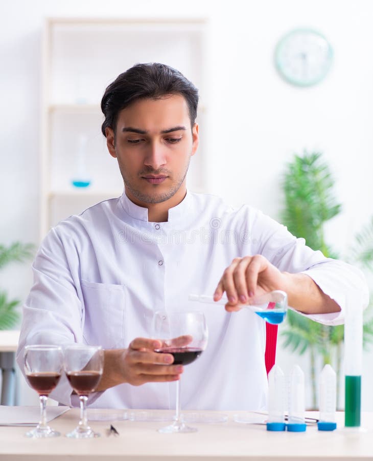 Male Chemist Examining Wine Samples at Lab Stock Photo - Image of ...