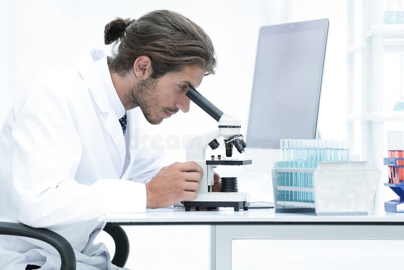 Male Chemist Scientific Reseacher Using Microscope in Laboratory Stock ...