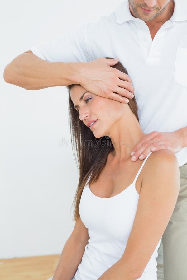 Chiropractor Doing Neck Adjustment Stock Photo - Image of adult ...