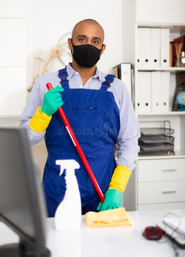 Male Cleaner in Protective Mask and Uniform at Office Stock Photo ...