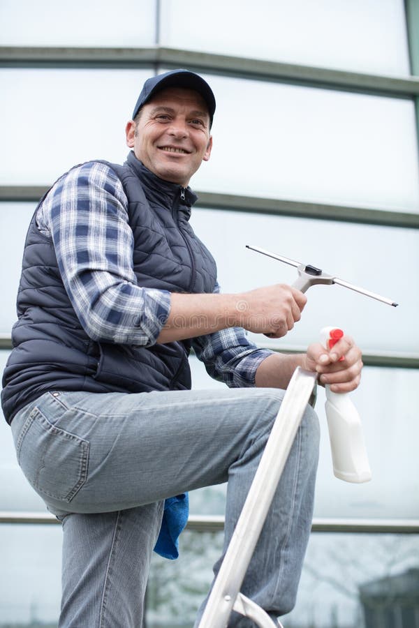 Male Cleaner Washes Windows and Store Front Stock Image - Image of ...