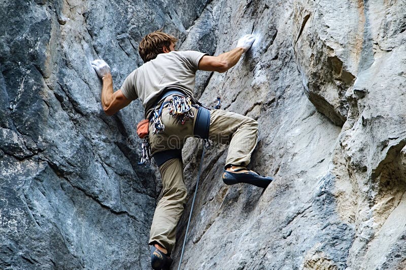 Male Climber Ascending Challenging Rock Face Using Chalk and Rope Stock ...