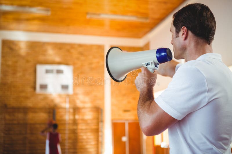 Male coach using megaphone stock photo. Image of focus - 96089542