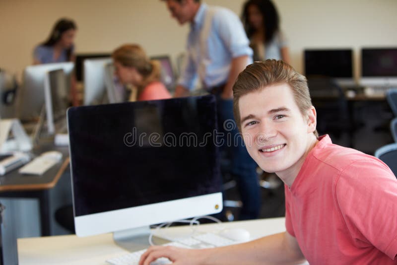 Male College Student Using Computer in Classroom Stock Image - Image of ...