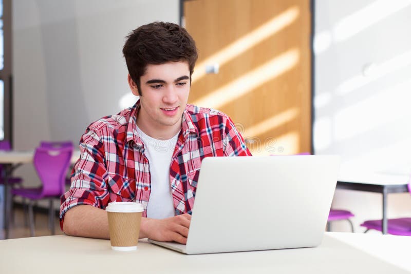 Male College Student Using Laptop in Classroom Stock Image - Image of ...