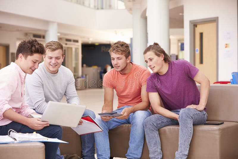 Male College Students Sitting and Talking Together Stock Photo - Image ...
