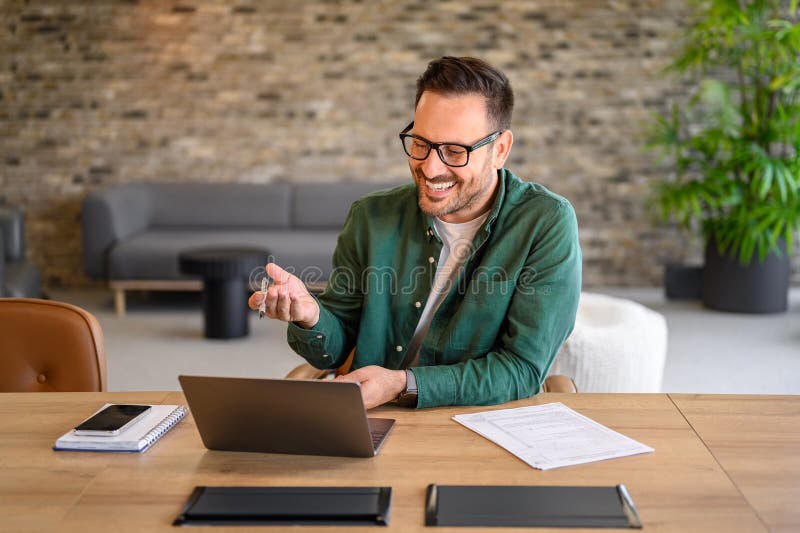 Male Computer Programmer Smiling and Discussing Project Details Over ...