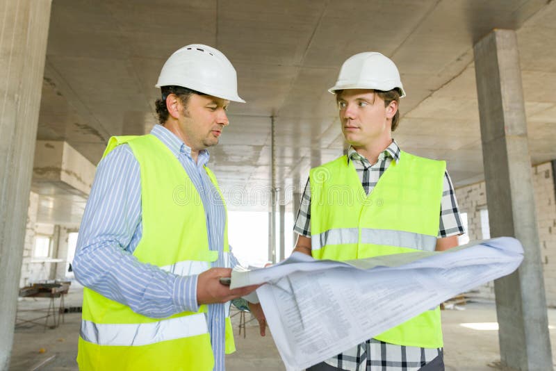 Male Construction Worker and Engineer at the Construction Site ...