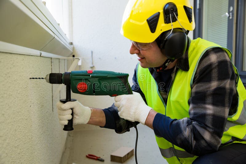 Male Construction Worker in Hard Hat Drilling Concrete Wall Stock Image ...
