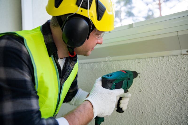 Male Construction Worker in Hard Hat Drilling Concrete Wall Stock Photo ...