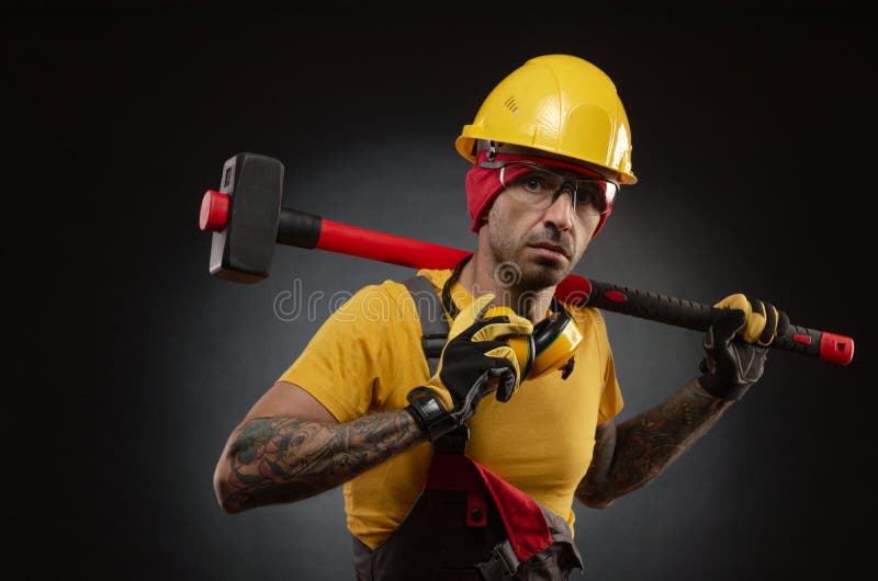 The Male Construction Worker with a Sledgehammer Stock Image - Image of ...