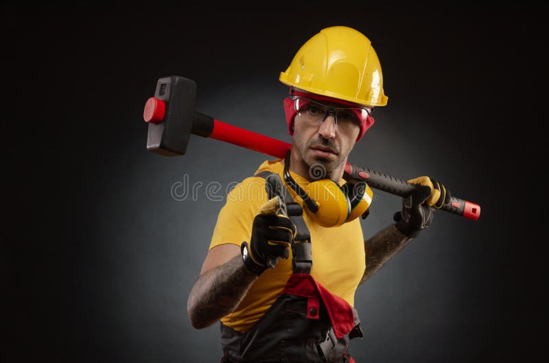 The Male Construction Worker with a Sledgehammer Stock Photo - Image of ...