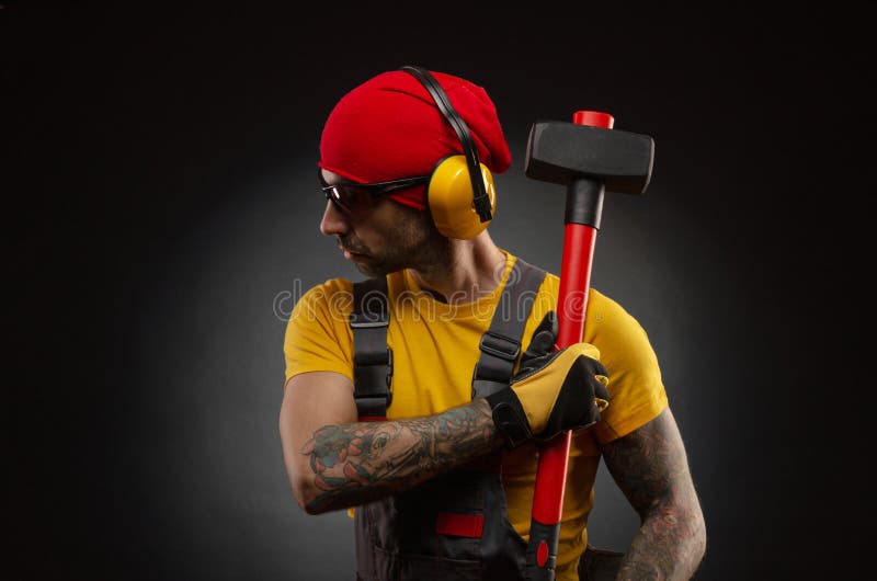 The Male Construction Worker with a Sledgehammer Stock Image - Image of ...