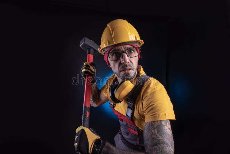 The Male Construction Worker with a Sledgehammer Stock Photo - Image of ...