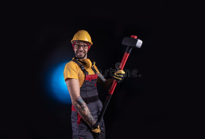 The Male Construction Worker with a Sledgehammer Stock Image - Image of ...