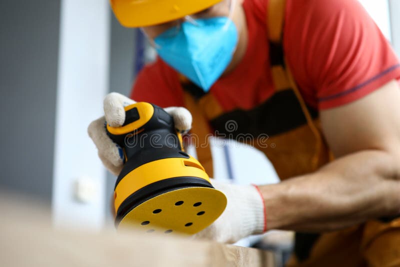 Male Construction Worker Wearing Hardhat and Protective Mask Using ...