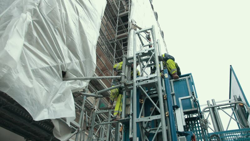 Male Construction Workers, Light Green Uniforms,Suits Stand at Working ...