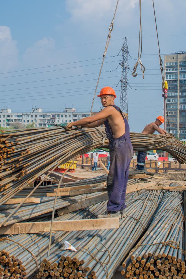Male Construction Workers Working at a Construction Site Editorial ...