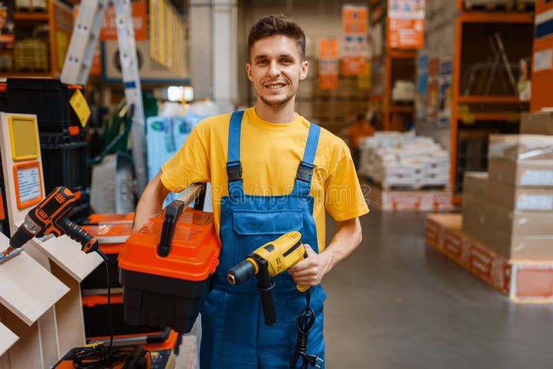 Male Constructor Holds Tools in Hardware Store Stock Image - Image of ...