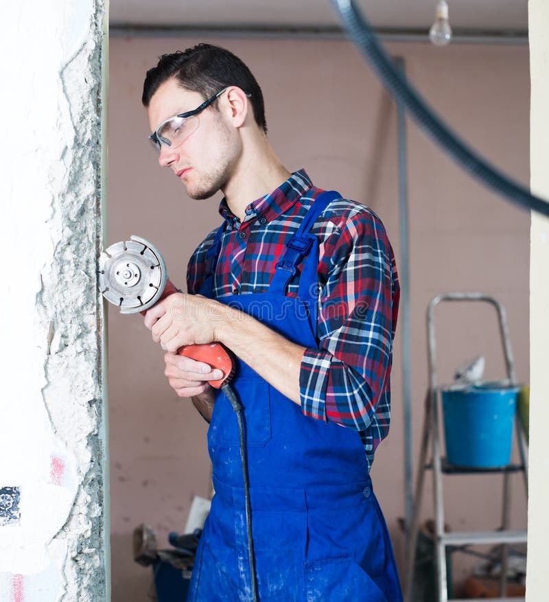 Male Contractor Using Angle Grinder Stock Photo - Image of european ...