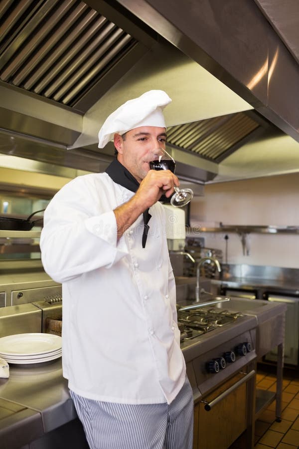 Male Cook Drinking Red Wine in Kitchen Stock Image - Image of chef ...