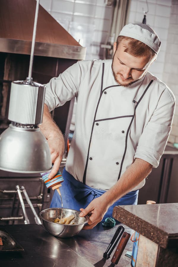 Male cook preparing meal stock photo. Image of black - 62170466