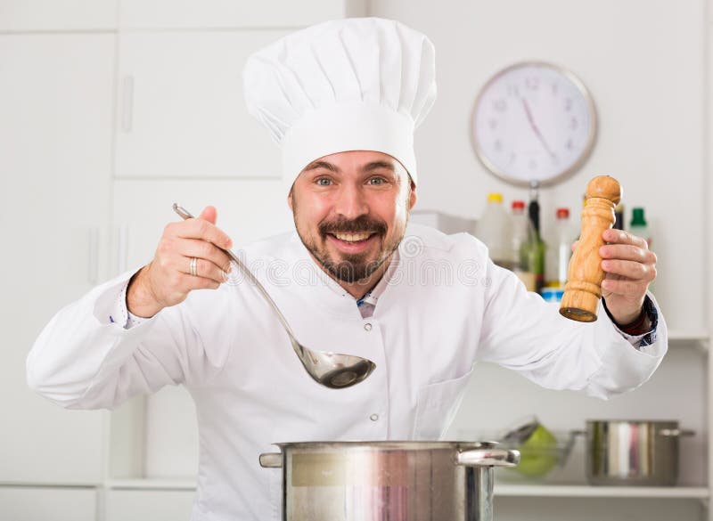 Male cook tasting food stock photo. Image of professional - 179667654