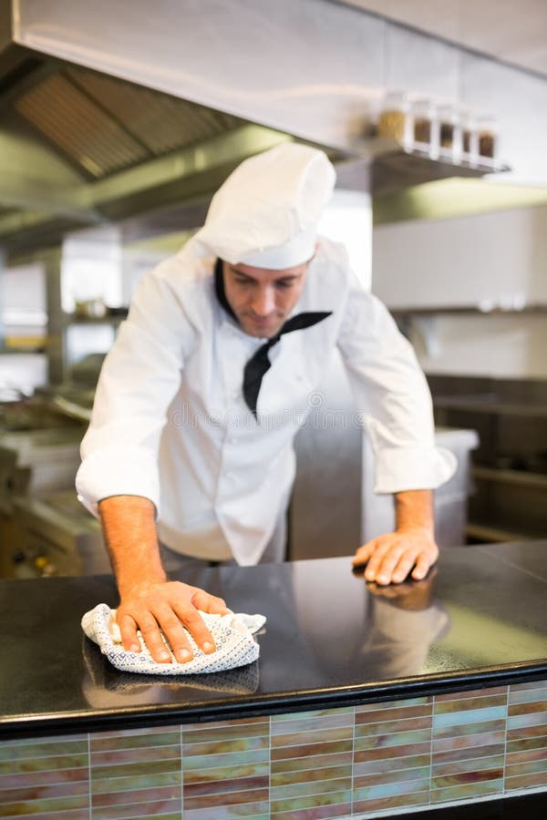 Male Cook Wiping Kitchen Counter Stock Image - Image of chef, indoors ...
