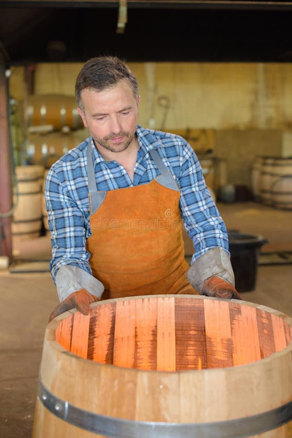 Male cooper at work stock photo. Image of indoors, distillery - 218239818