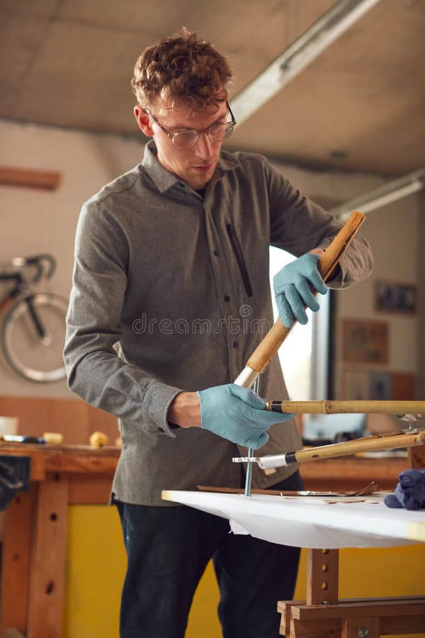 Male Craftsman in Workshop Assembling Hand Built Sustainable Bamboo ...