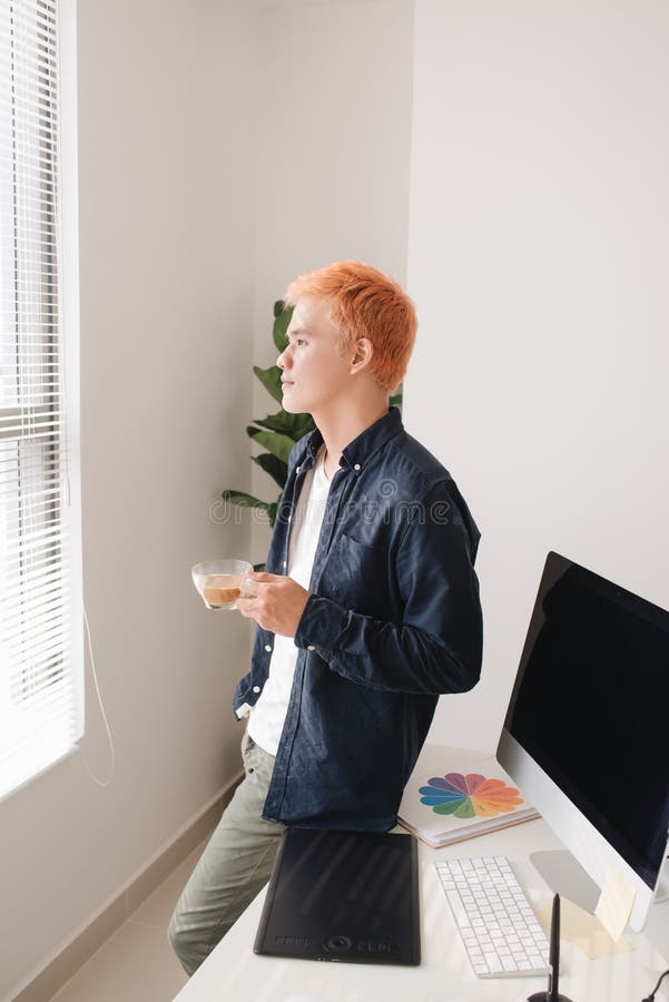 Male Creative Worker Standing in Front of Desk in the Creative O Stock ...