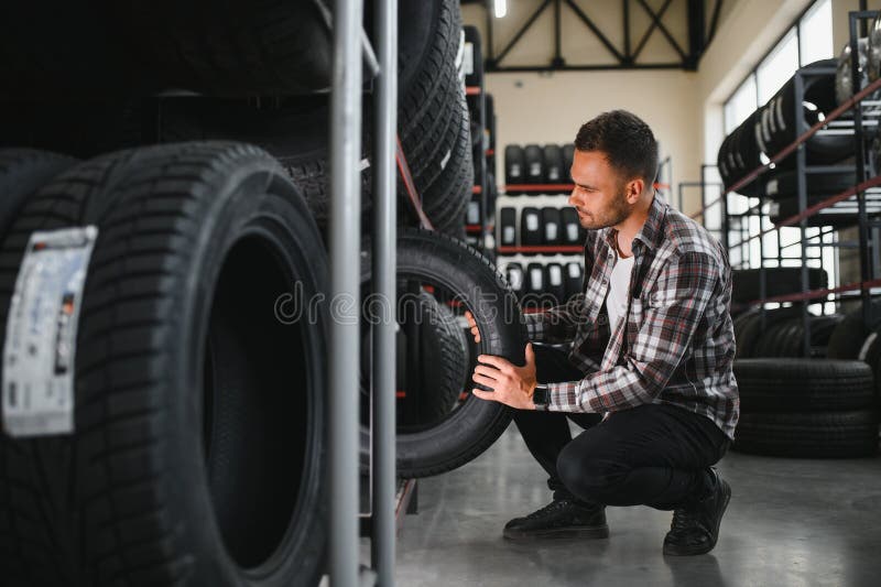 A Male Customer in a Car Tire Shop Stock Photo - Image of choice, tyre ...