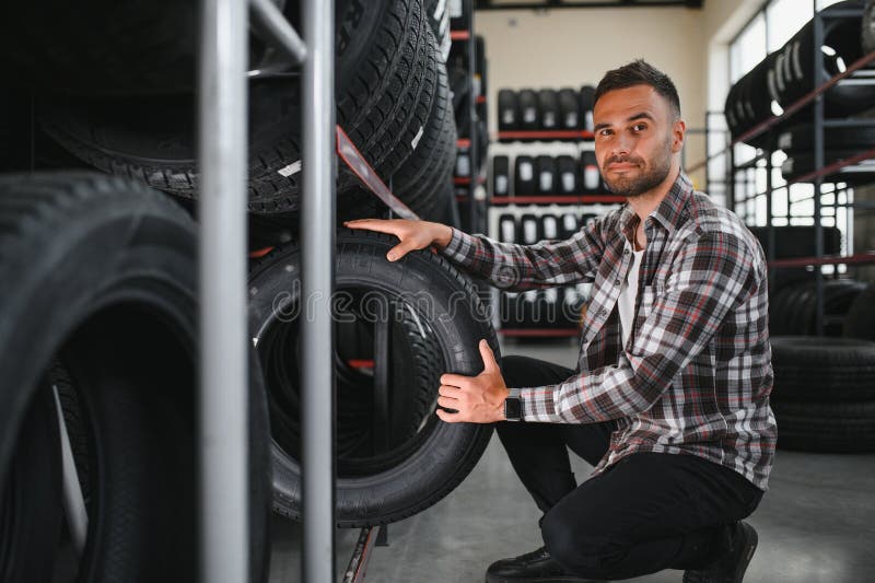 A Male Customer in a Car Tire Shop Stock Photo - Image of pattern, male ...