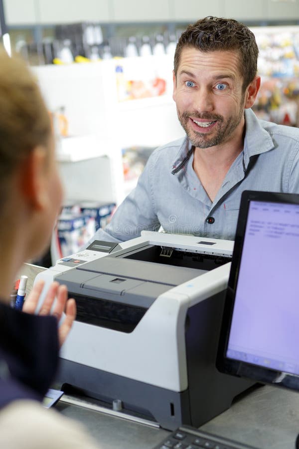 Male Customer Getting Help at Pay Desk Stock Photo - Image of caucasian ...