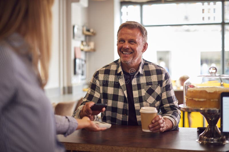 Male Customer Making Contactless Payment in Coffee Shop Using Mobile ...