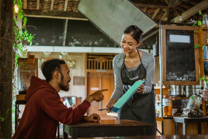 The Male Customer Pointing on the Book of Menu Stock Image - Image of ... The Male Customer Pointing on the Book of Menu Stock Image - Image of ...
